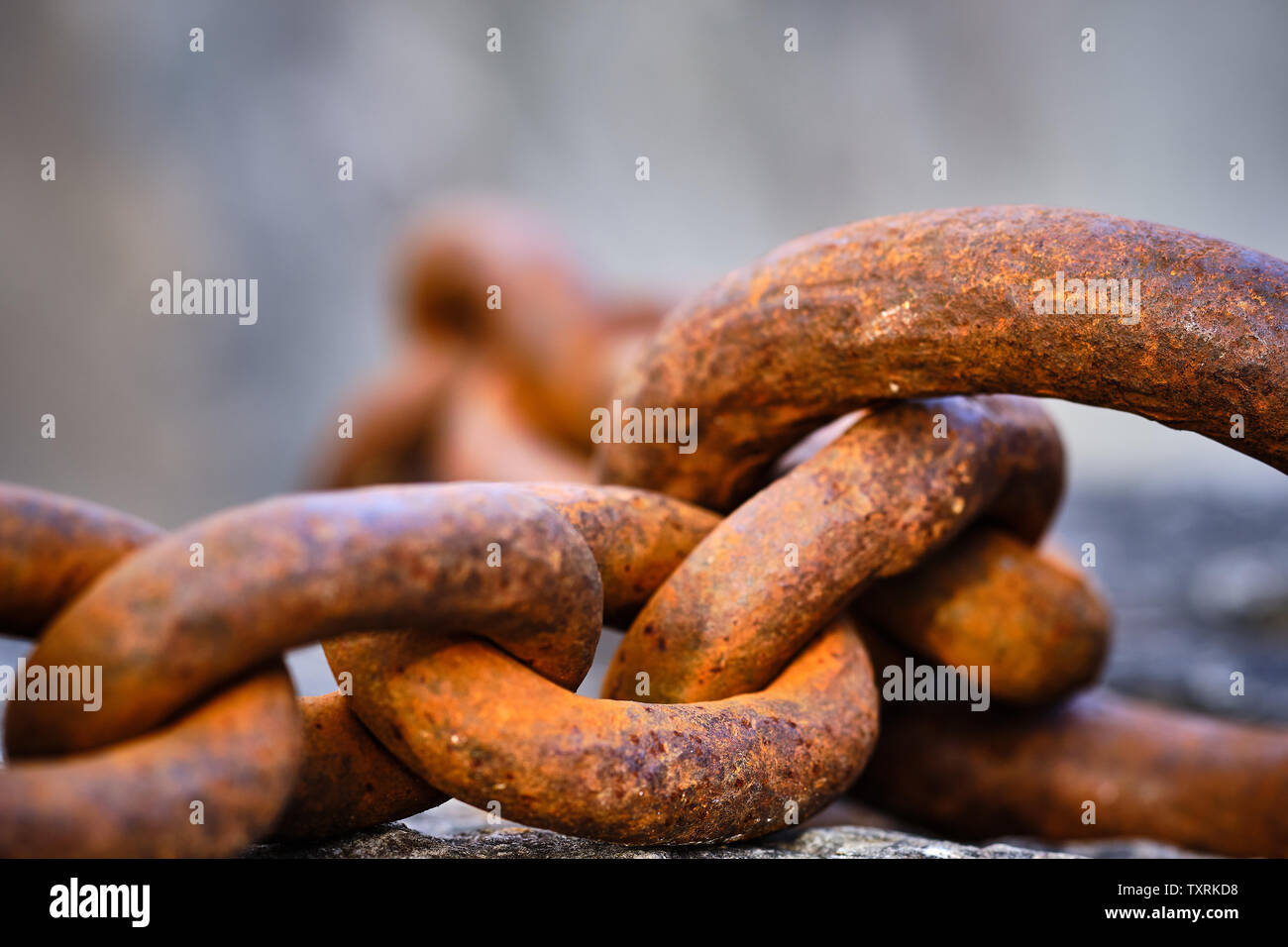 rusty big chain lying on a stone Stock Photo - Alamy