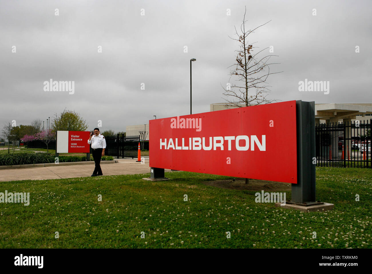 A Halliburton security guard stands by an entrance in Houston, Texas on ...