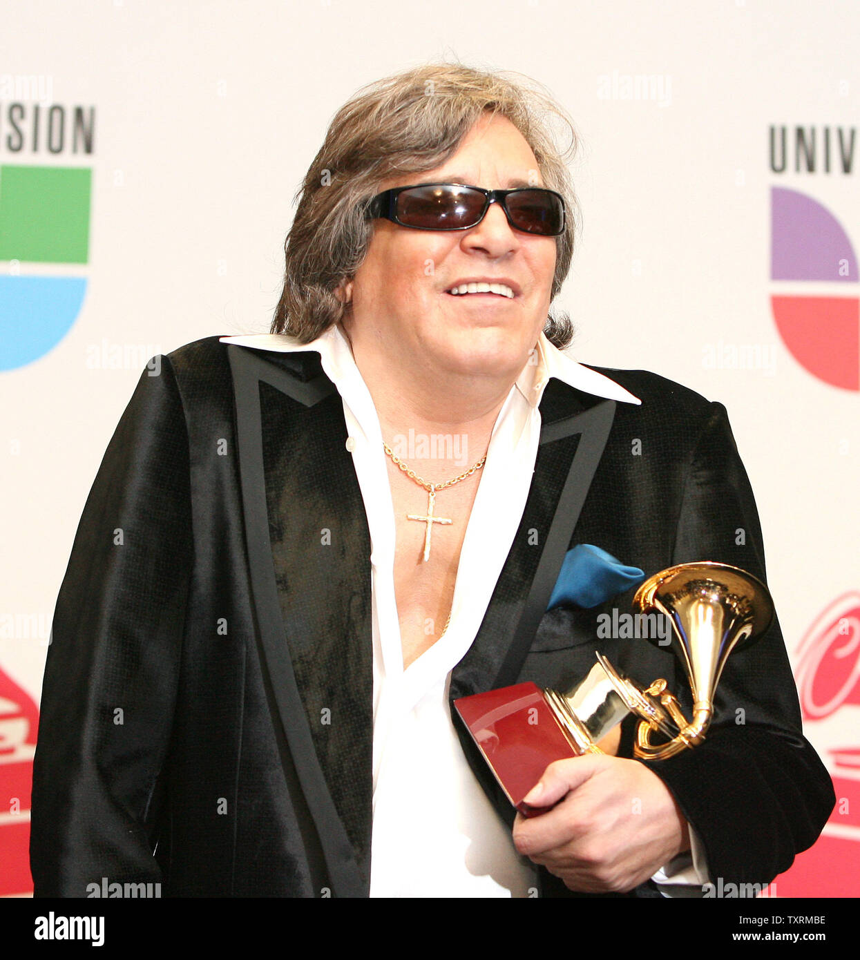 Entertainer Jose Feliciano holds his contemporary tropical album award ...