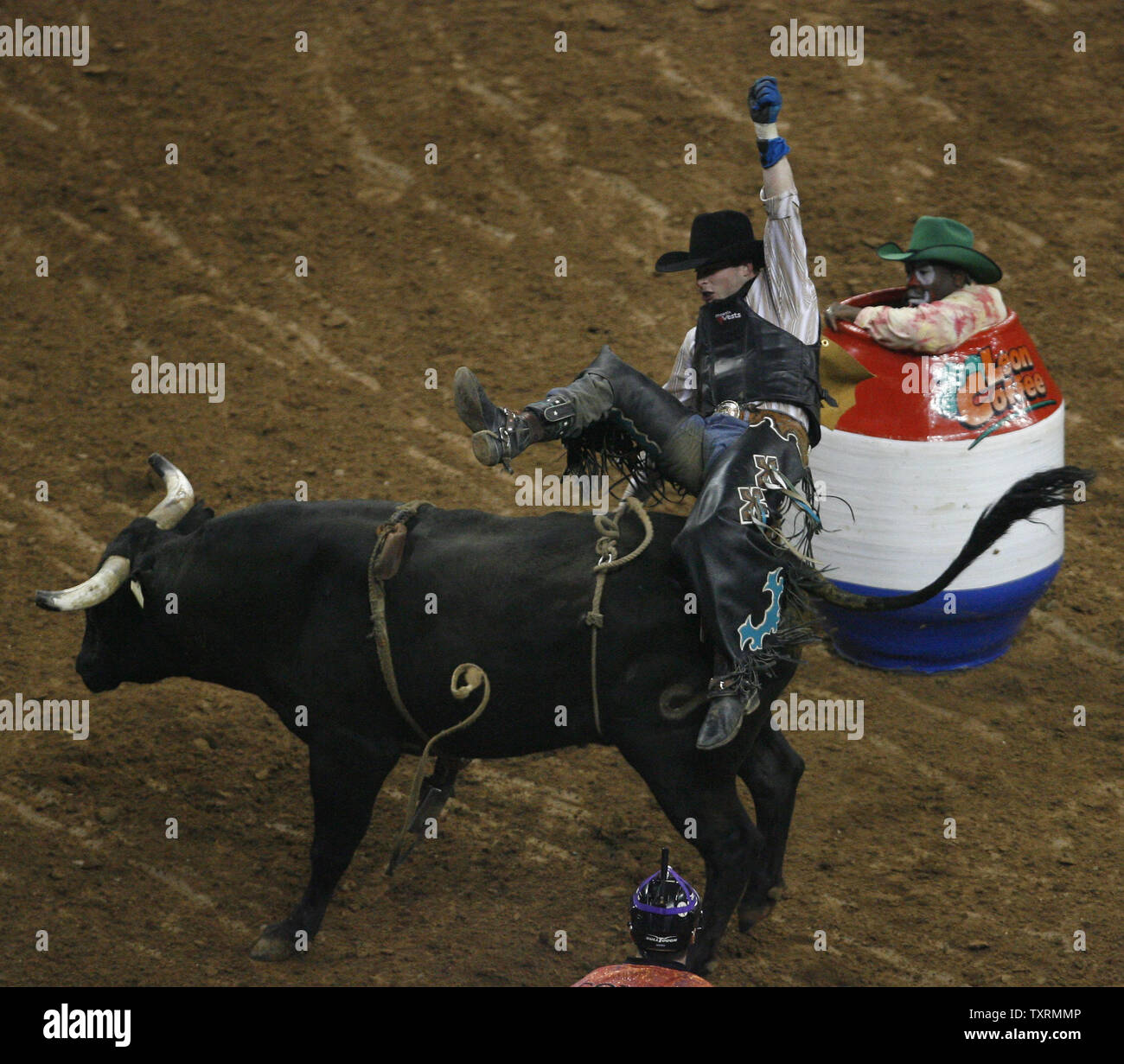 Douglas Duncan is thrown off from a bull during the PRCA Xtreme Bull ...