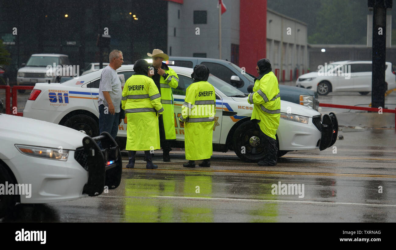 First responders awaits rescuers arrival during the storm. As rain ...