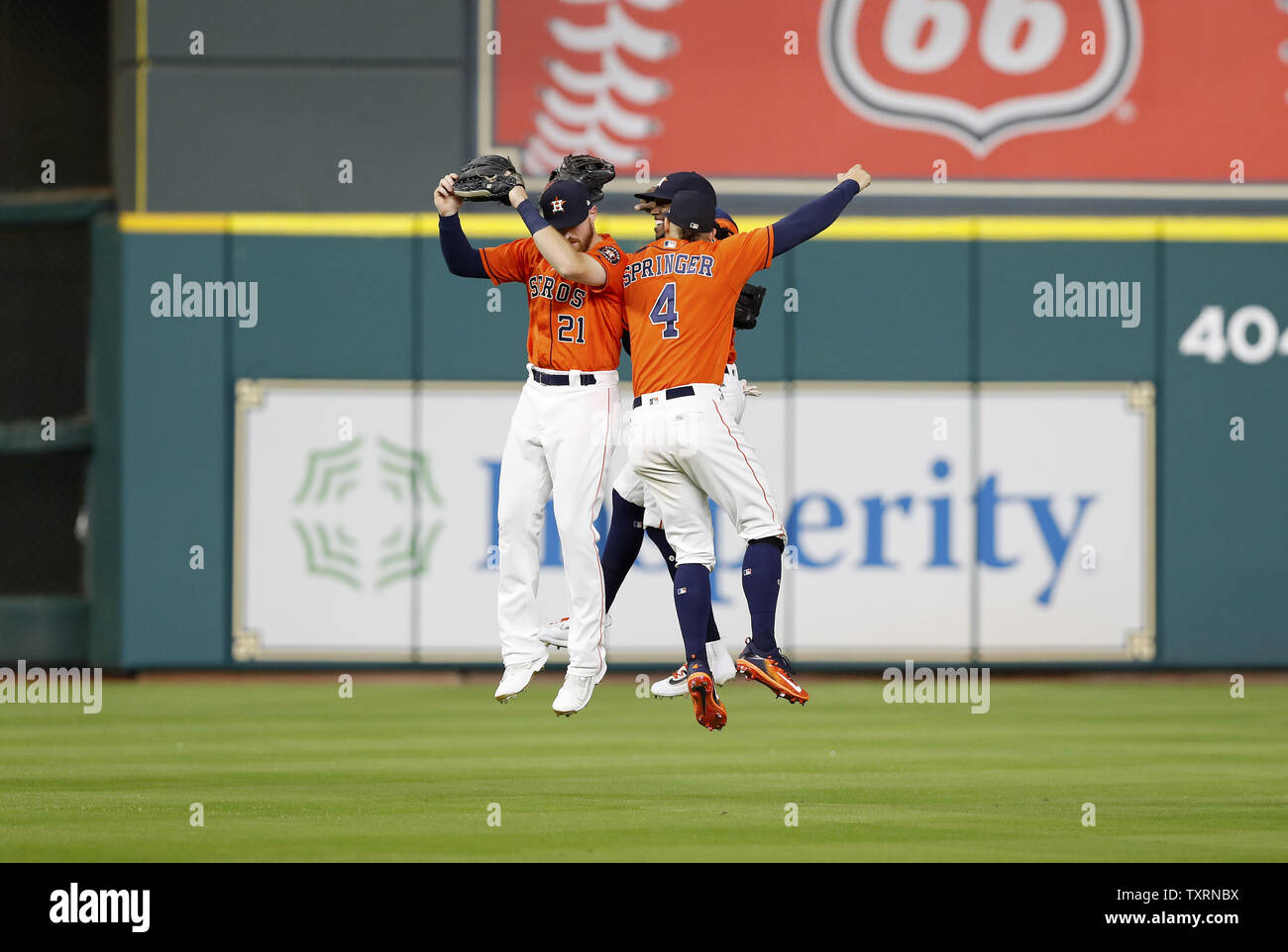 Houston Astros right fielder George Springer (4), left fielder Derek ...