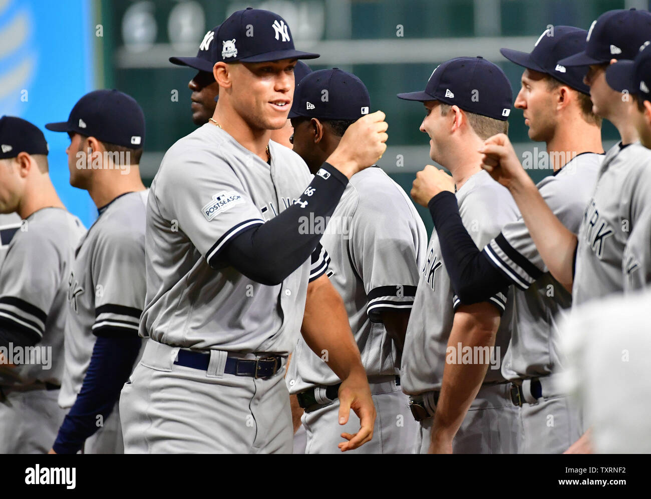 New York Yankees' Aaron Judge (C) greets teammates during introductions ...