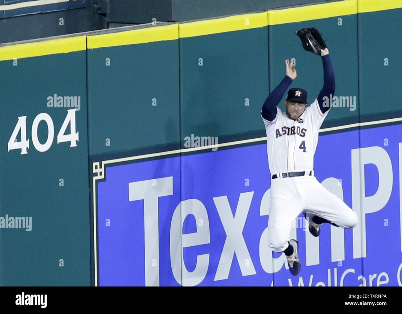 Houston Astros center fielder George Springer makes a leaping catch off ...