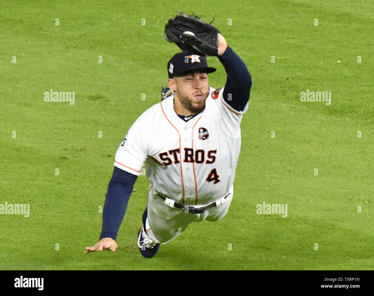 Houston Astros center fielder George Springer stretches in a diving ...
