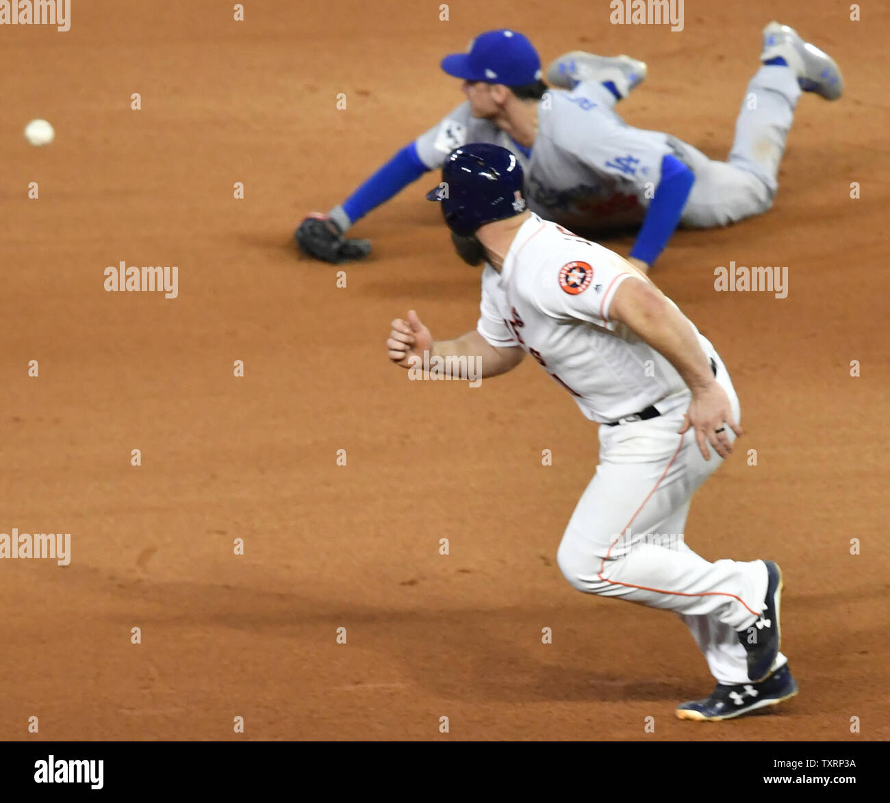 Houston Astros DH Evan Gattis advances to second base on teammate Brian ...