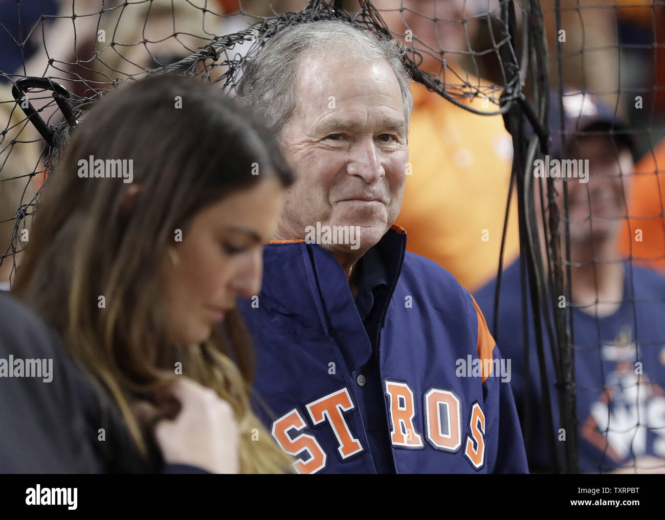 Former President George W. Bush is seen before throwing out the first ...