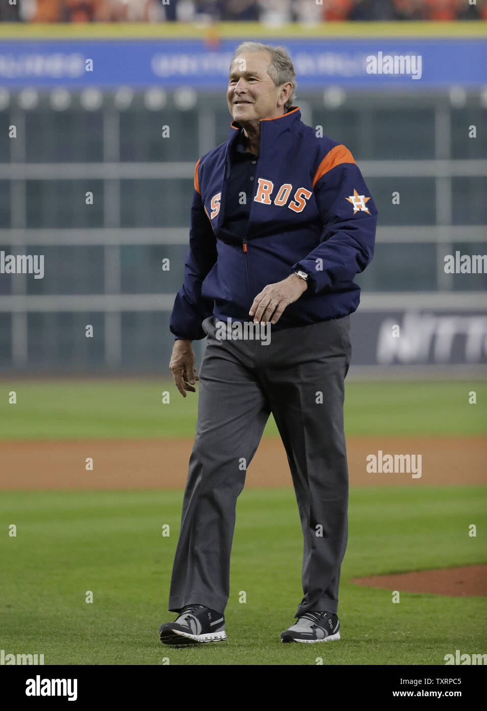 Former President George W. Bush throws out the first pitch and ...