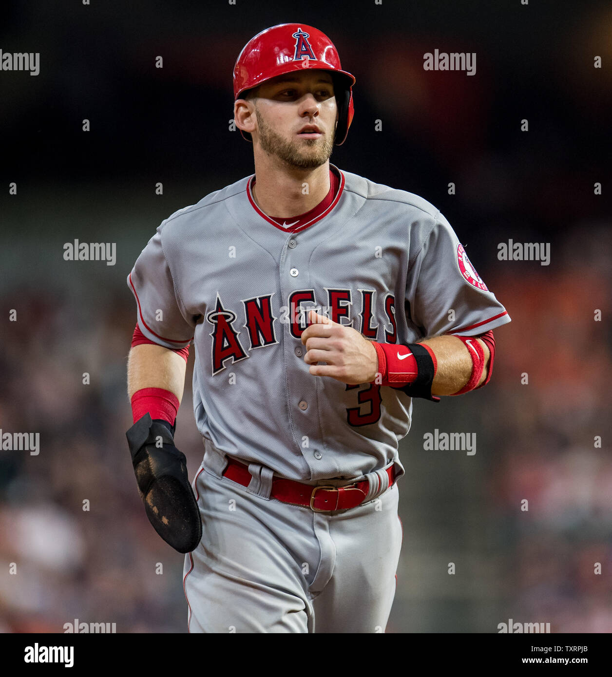 Taylor Ward of the Los Angeles Angels walks home to score a run against ...