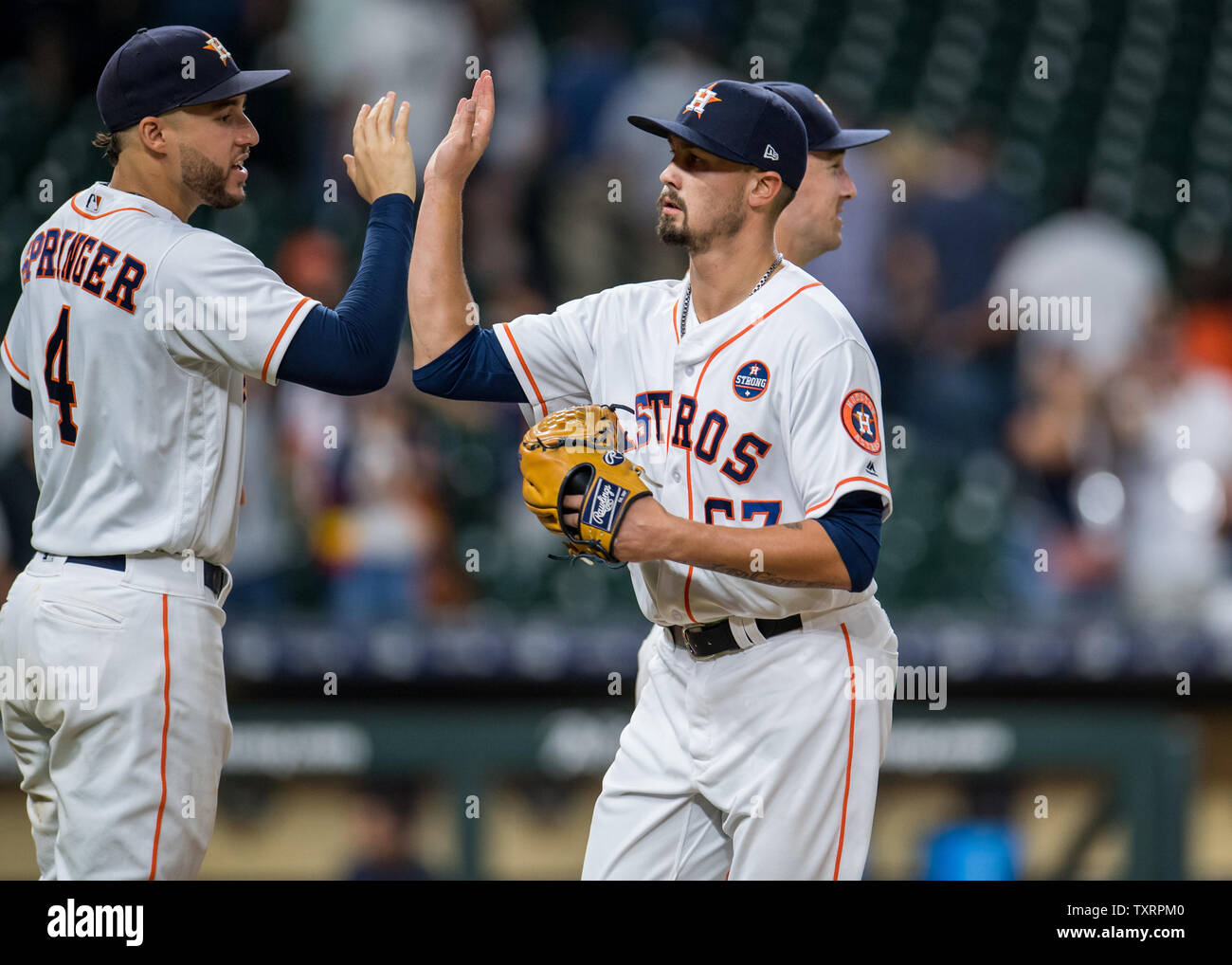 Houston Astros relief pitcher Dean Deetz celebrates a 9-1 victory with ...
