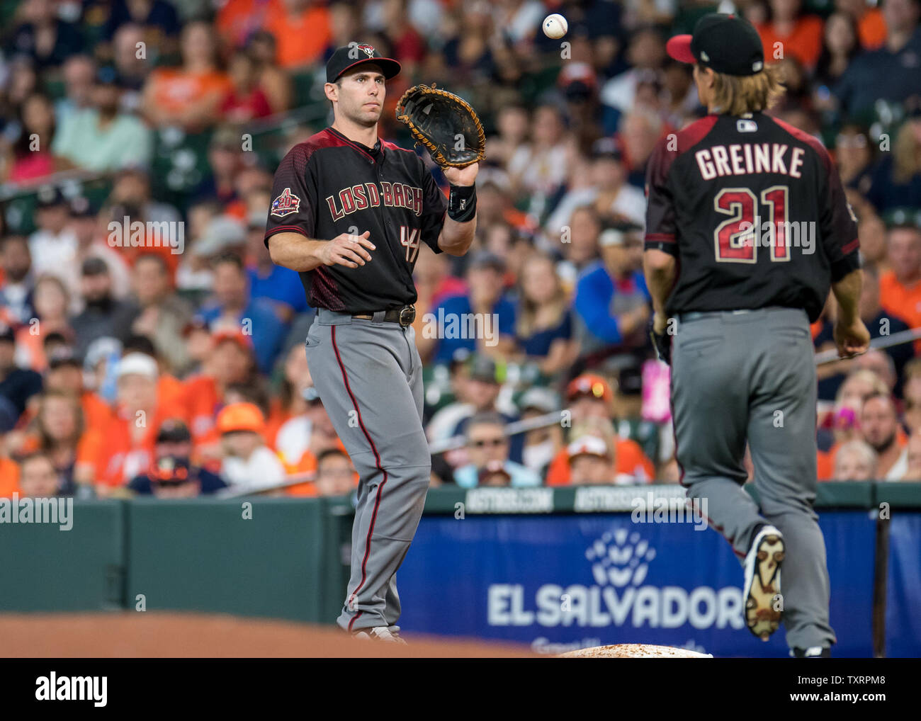 Paul Goldschmidt of the Arizona Diamondbacks catches a toss from pitcher Zack Greinke to record ...