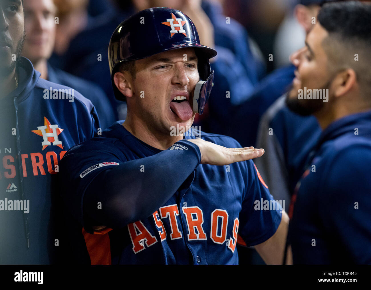 Houston Astros third baseman Alex Bregman celebrates in the dugout ...