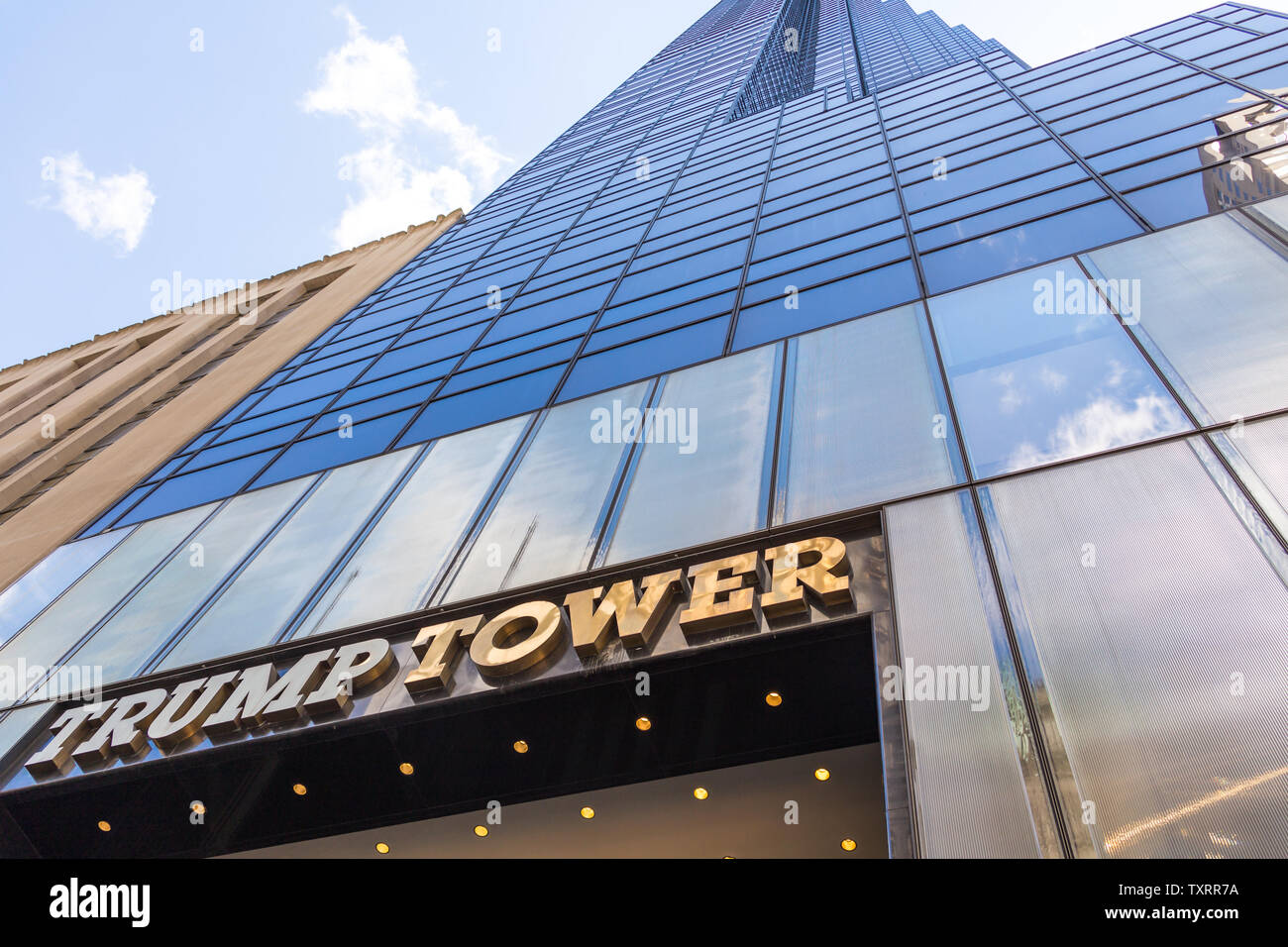 NEW YORK, USA - MAY 15, 2019: Low angle of the gold facade of Trump ...