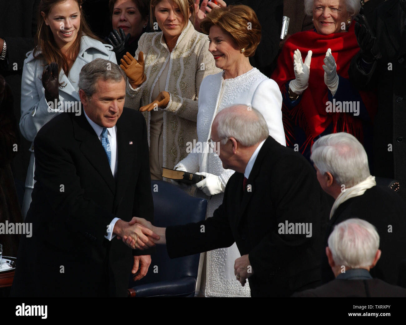 Vice President Dick Cheney, right, shakes hands with President George W ...