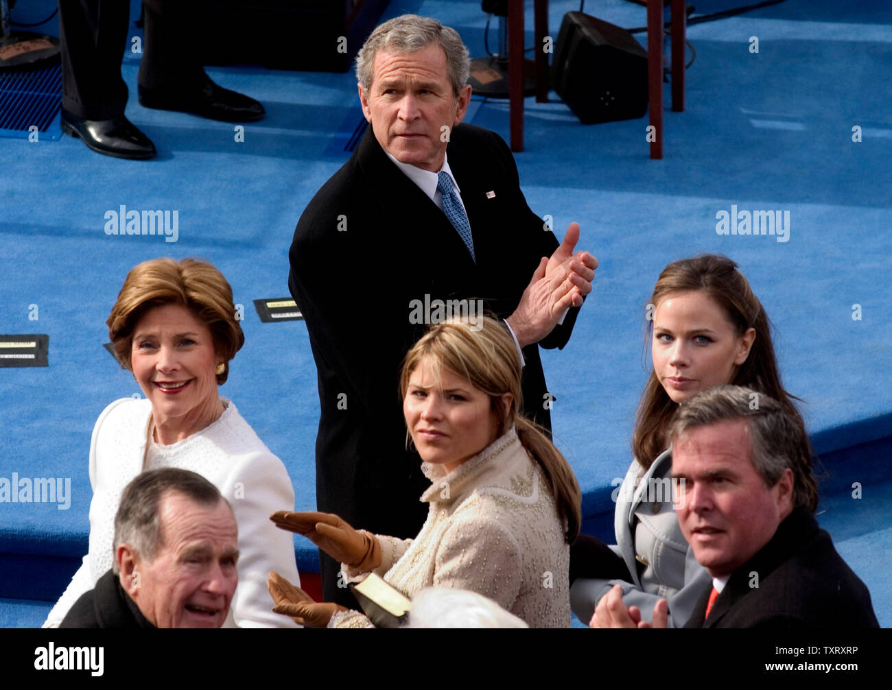 President George W. Bush applauses the Navy Academy choir with First ...