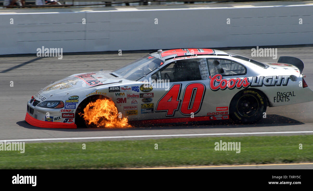 Sterling Marlin burns up his front tire after a blow-out in the 11th ...