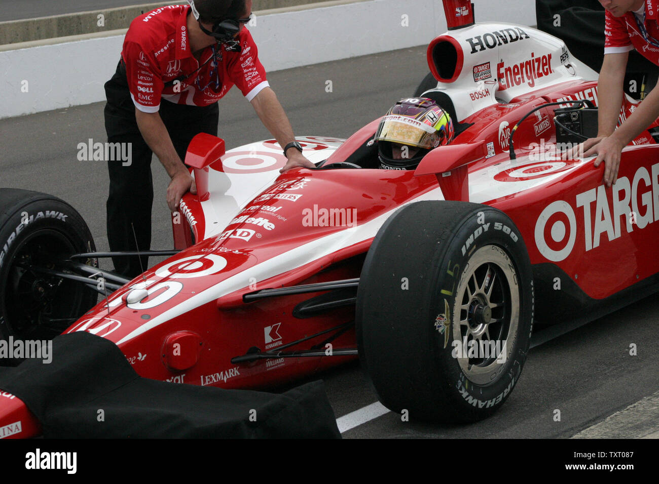 2006 Indianapolis 500 winner Dan Weldon is pushed back to his pits ...