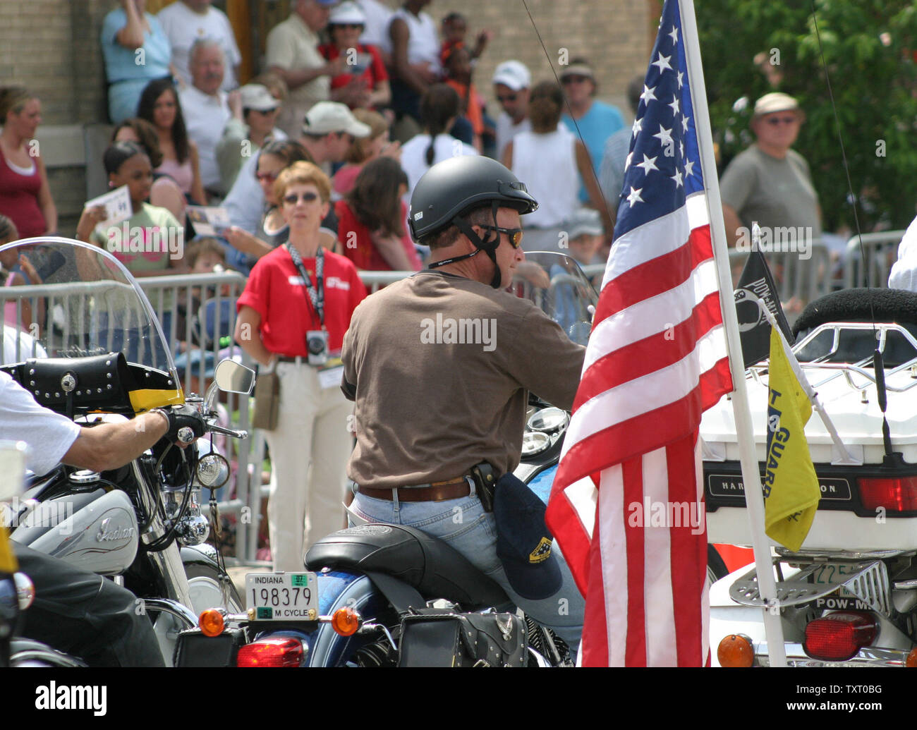 Indiana Governor Mitch Daniels mounts his motorcycle to begin his ...