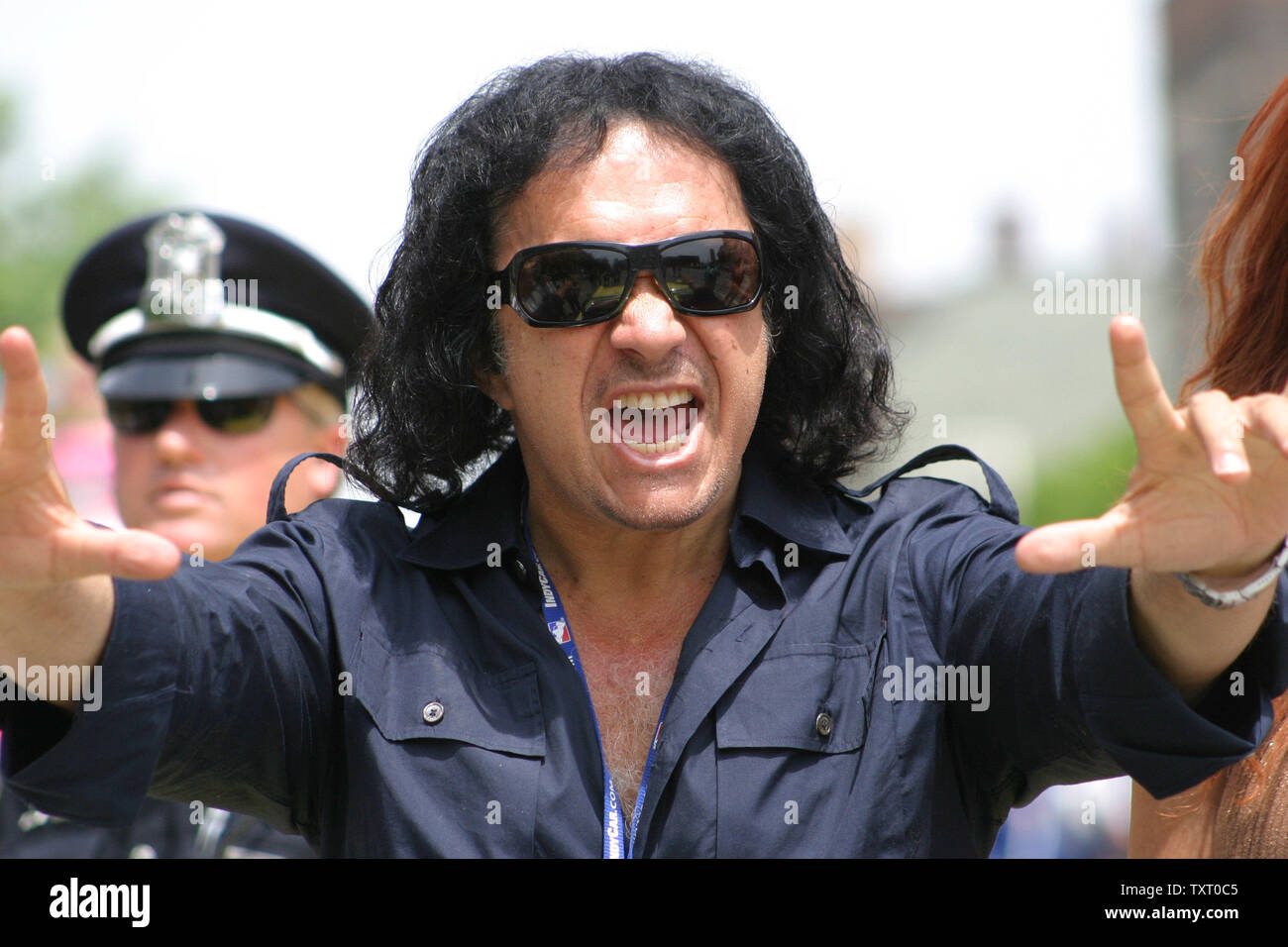 Gene Simmons of the Rock Group KISS shows his fans his trademark hi ...