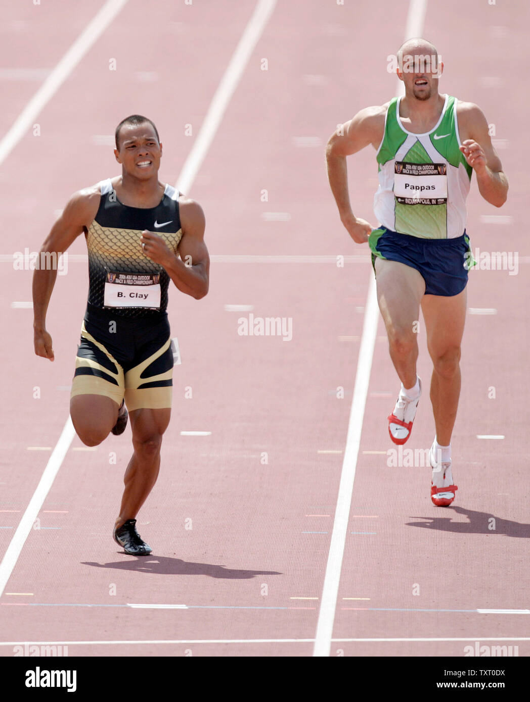 Bryan Clay of team Nike, left, leads teammate Tom Pappas in the second ...