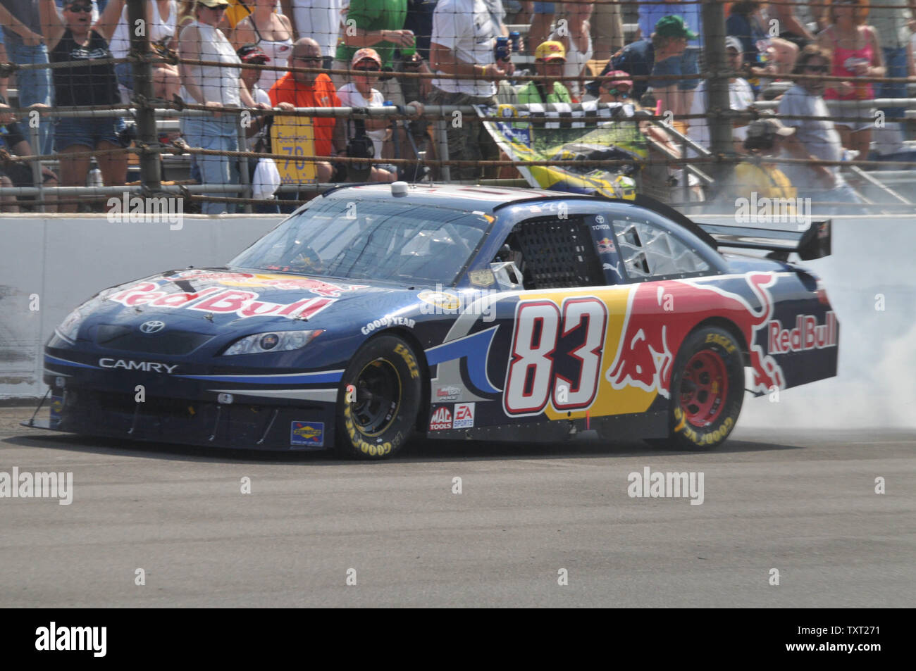 Smoke pours from the Brian Vickers Red Bull Toyota just past the ...