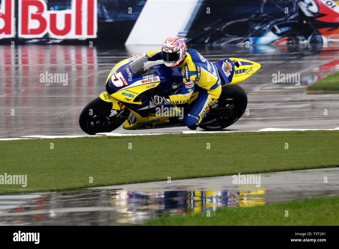 Colin Edwards of the United States races through turn 16 in heavy rain ...