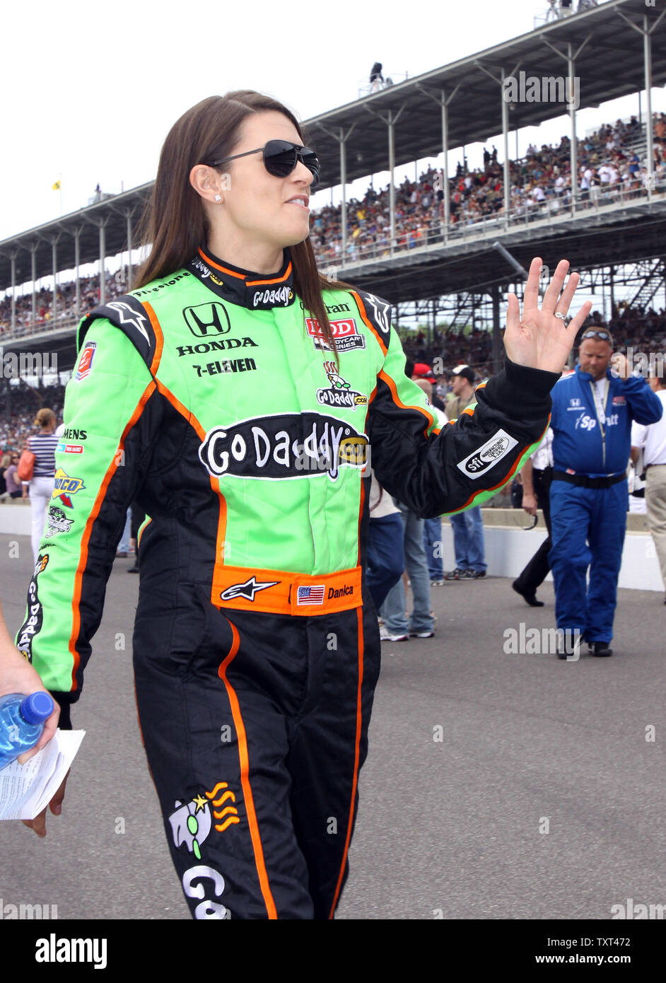 Indycar driver Danica Patrick waves to fans before the start of the ...