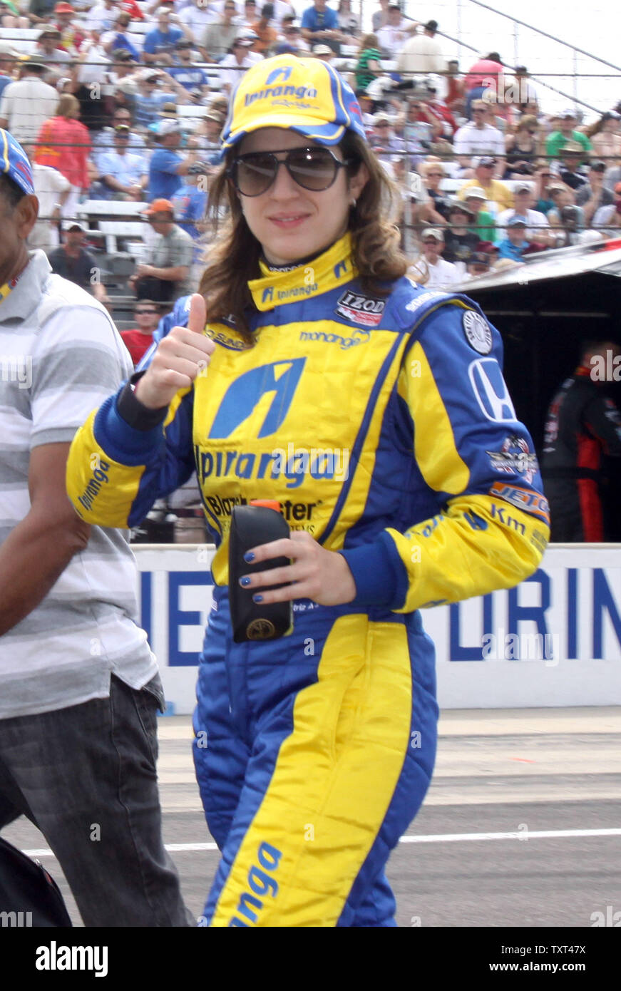 Ana Beatriz, from Brazil, gives the thumbs-up to fans before the start ...