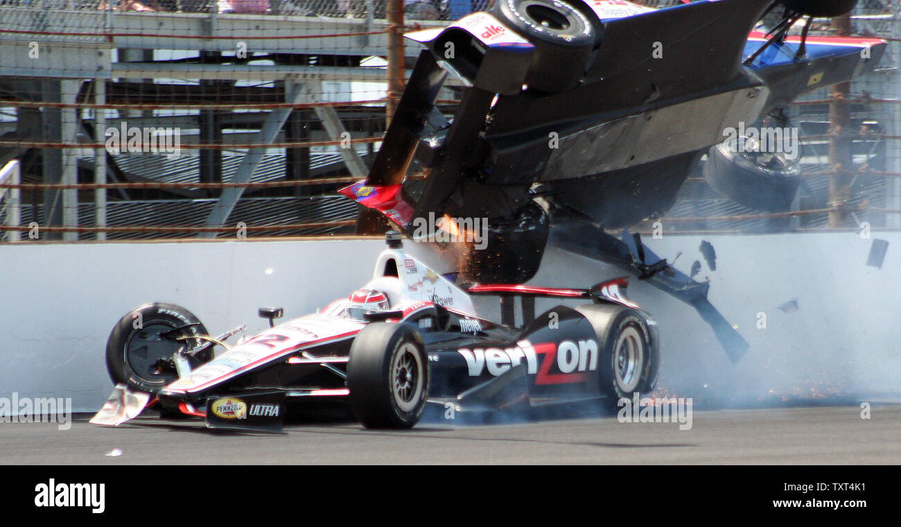 England's Mike Conway (14) goes airborne over Australia's Will Power ...