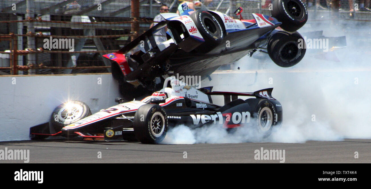 England's Mike Conway (14) goes airborne over Australia's Will Power ...