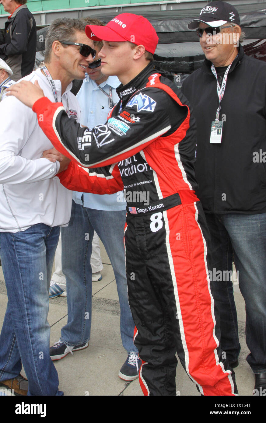 Sage Karam hugs his crew members after winning the pole position for ...