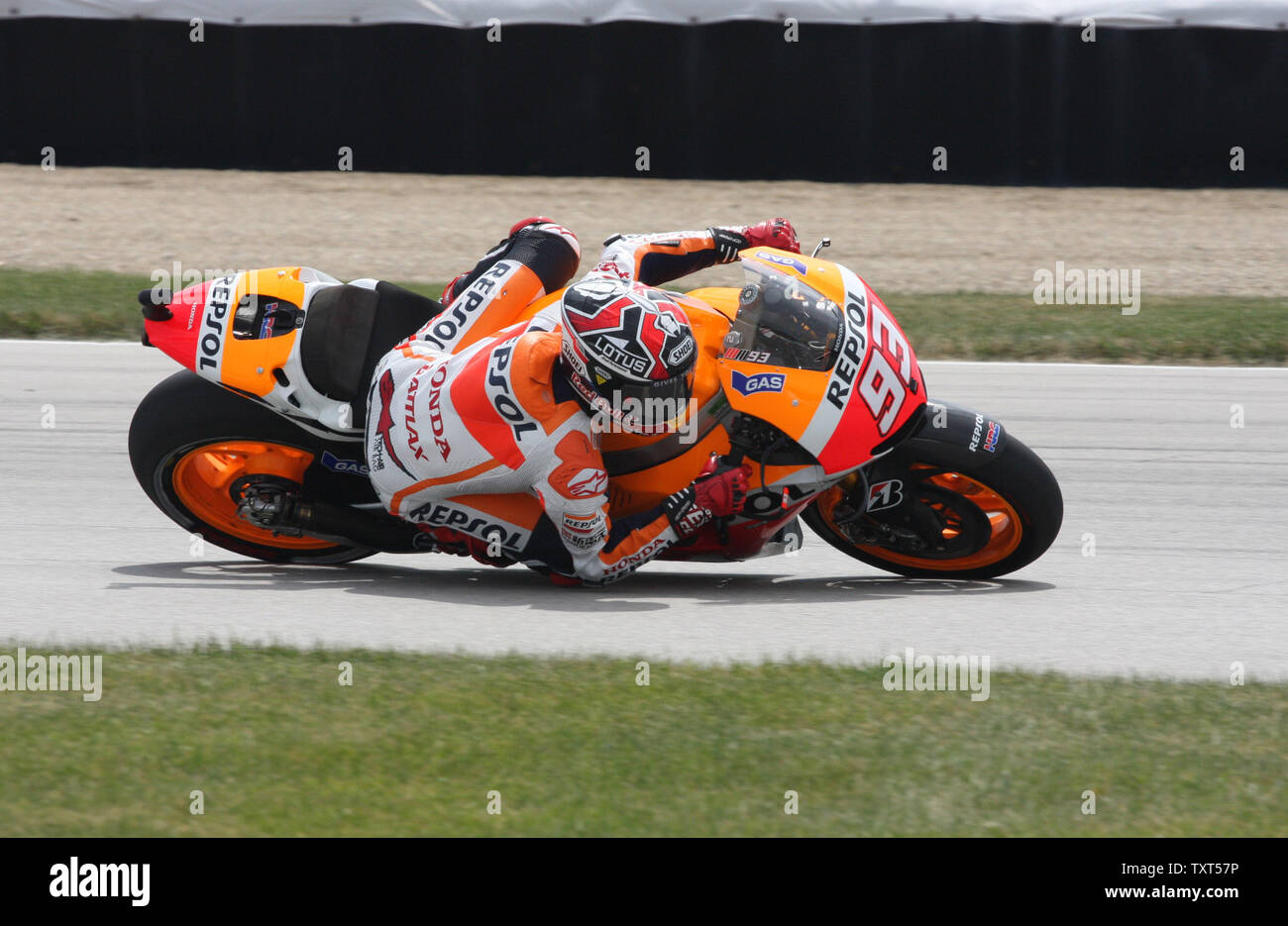 Marc Marquez leans down as he speeds through the treacherous hairpin ...