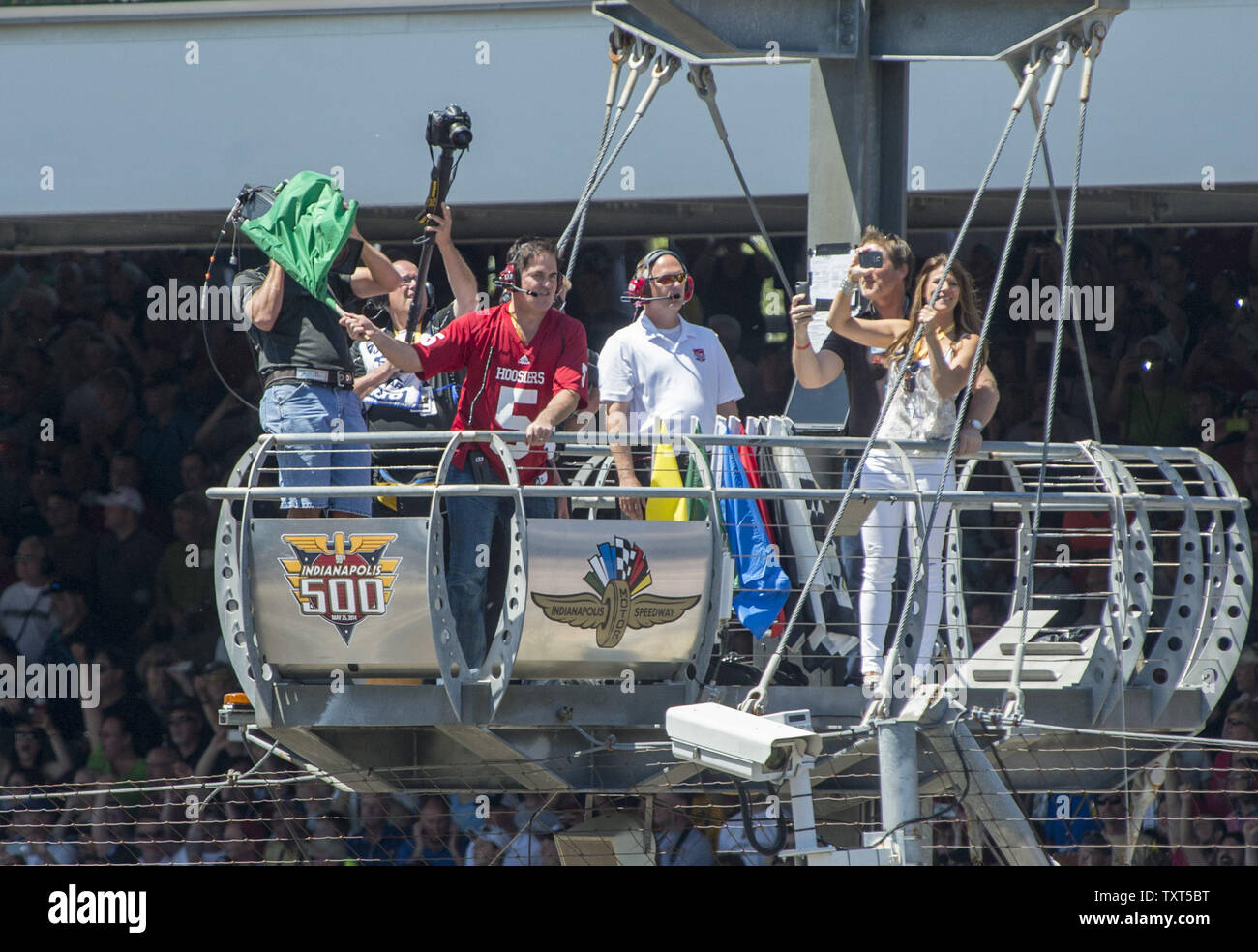 Dallas Mavericks owner Rick Cuban waves the green flag to start the ...