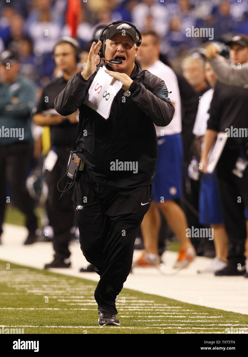 Philadelphia Eagles head coach Chip Kelly runs onto the field as he ...