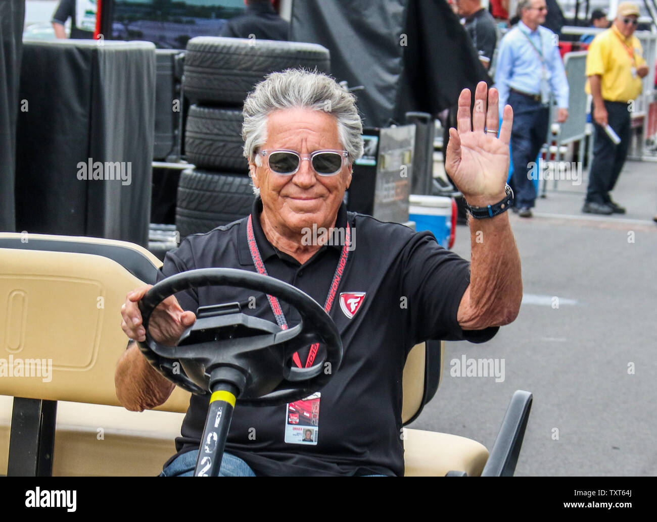 1969 Indy 500 winner Mario Andretti waves to the crowd as he enters the ...