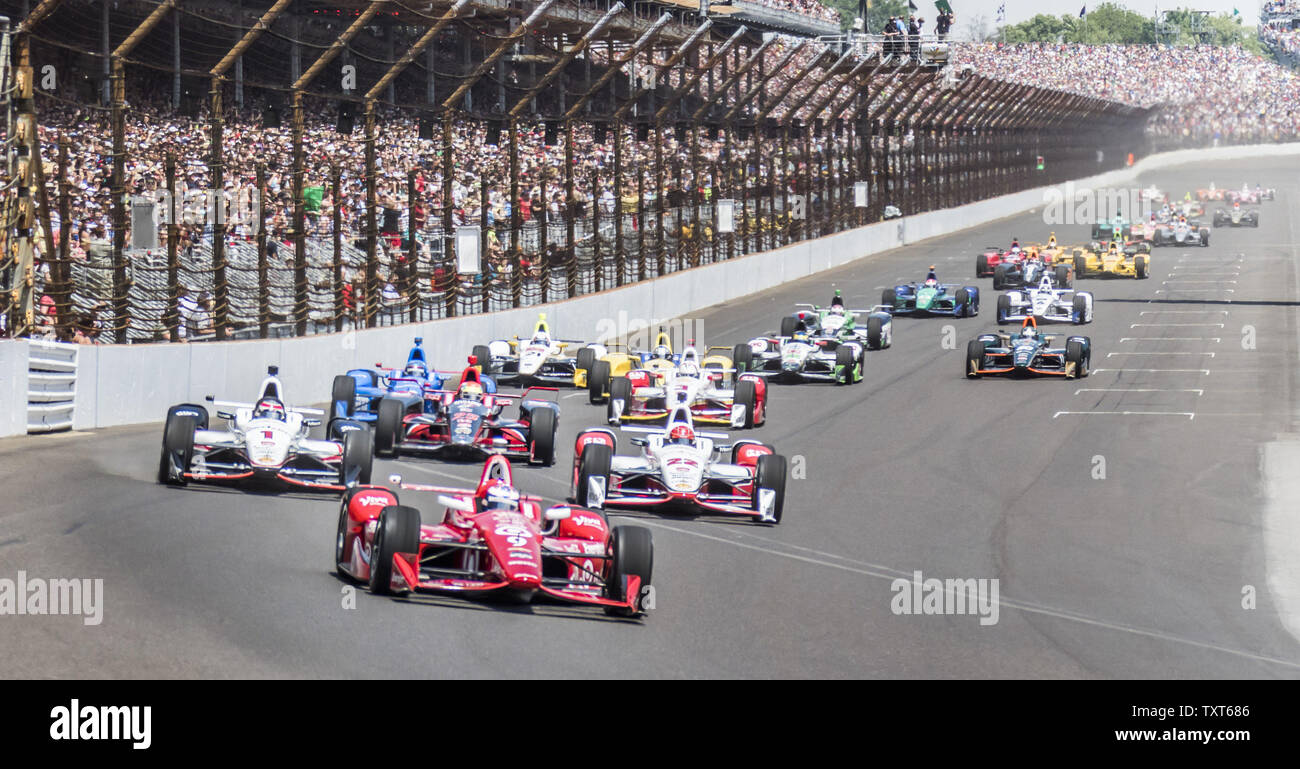 Cars come into the first turn at the start the 99th running of the ...