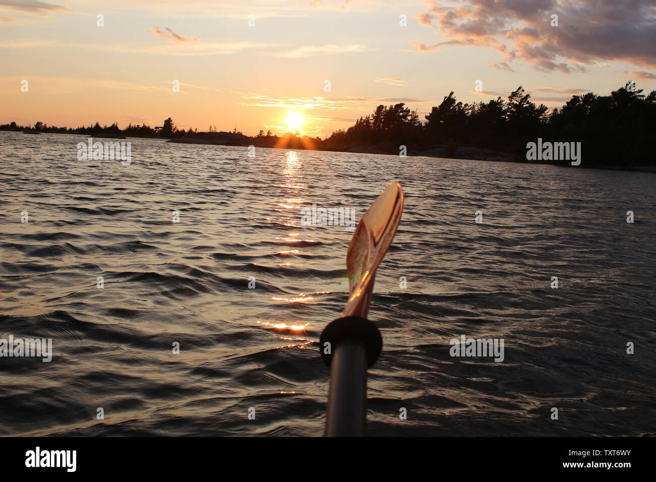 Paddling Canoe in the Sunset, kayaking in beautiful Georgan bay waters ...