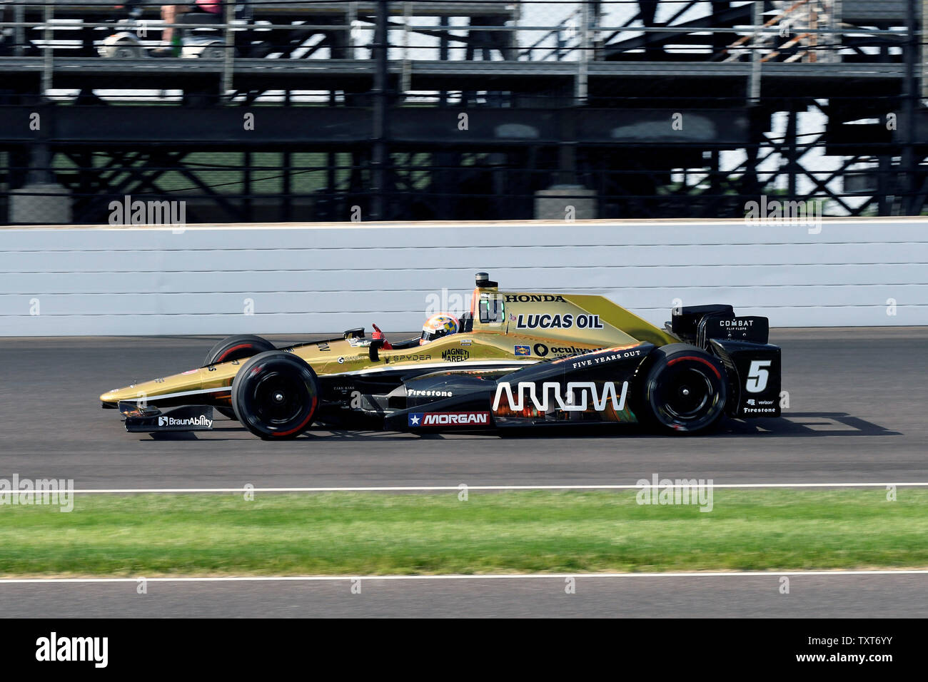 James Hinchcliffe waves to the crowd after winning the pole position on ...