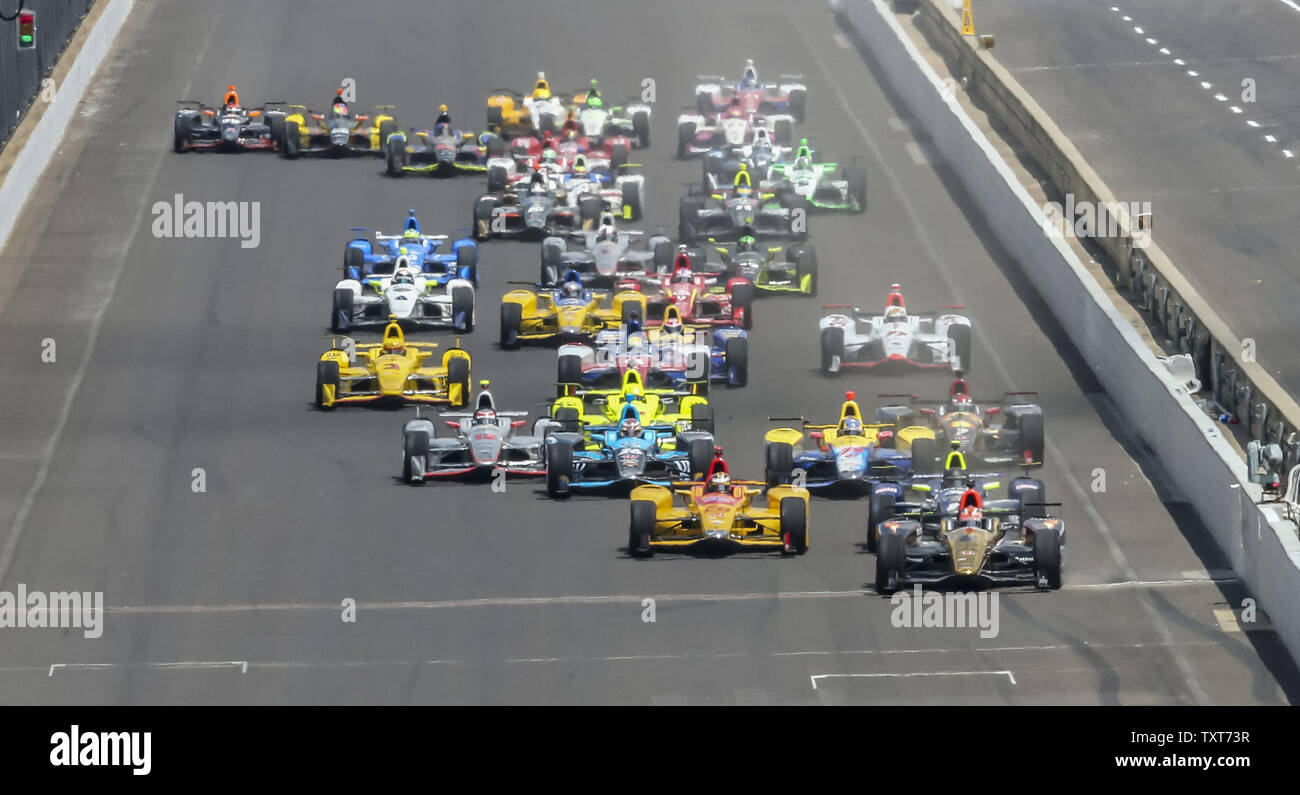 The field comes down the front straight for the start of the 100th ...