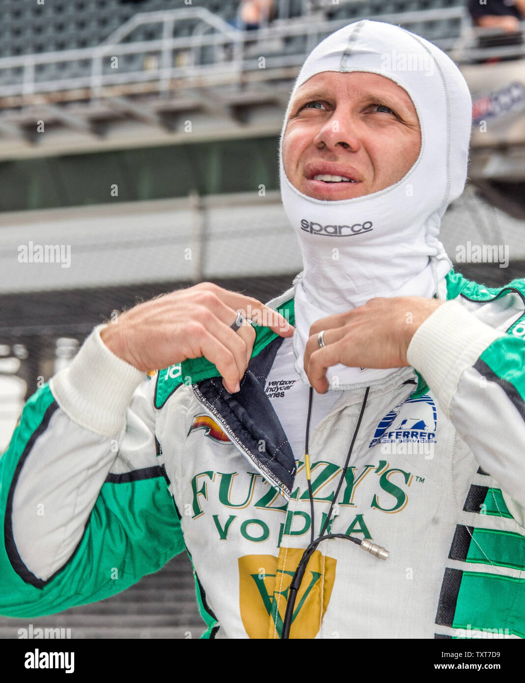 Ed Carpenter looks skyward at the wind speed indicator during day 3 ...