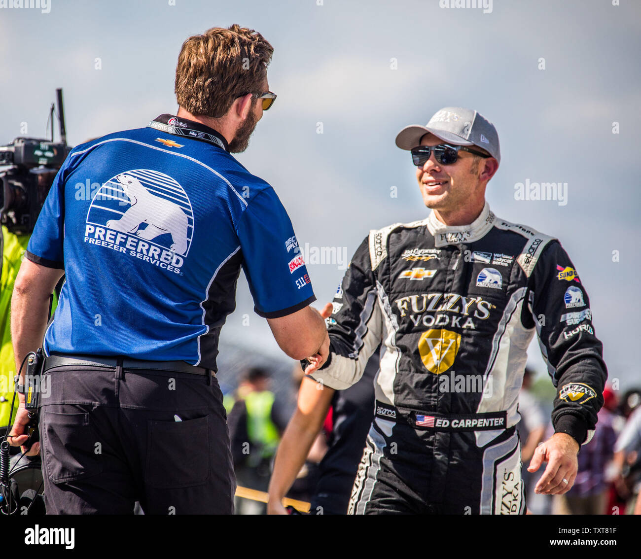 Ed Carpenter (right) is congratulated after setting the second fastest ...