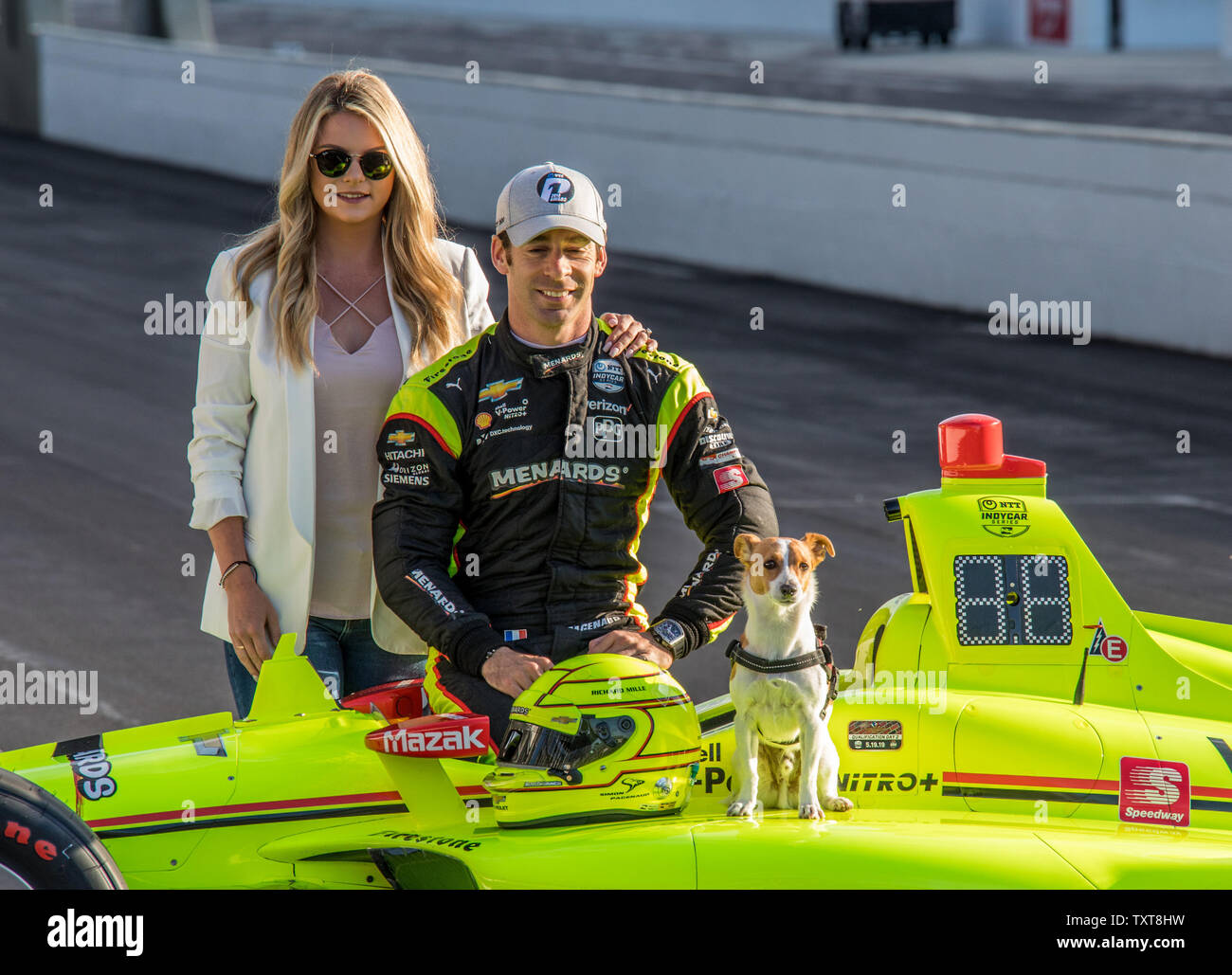 Simon Pagenaud, fiancee Hailey McDermott, and Norman (right) pose the ...