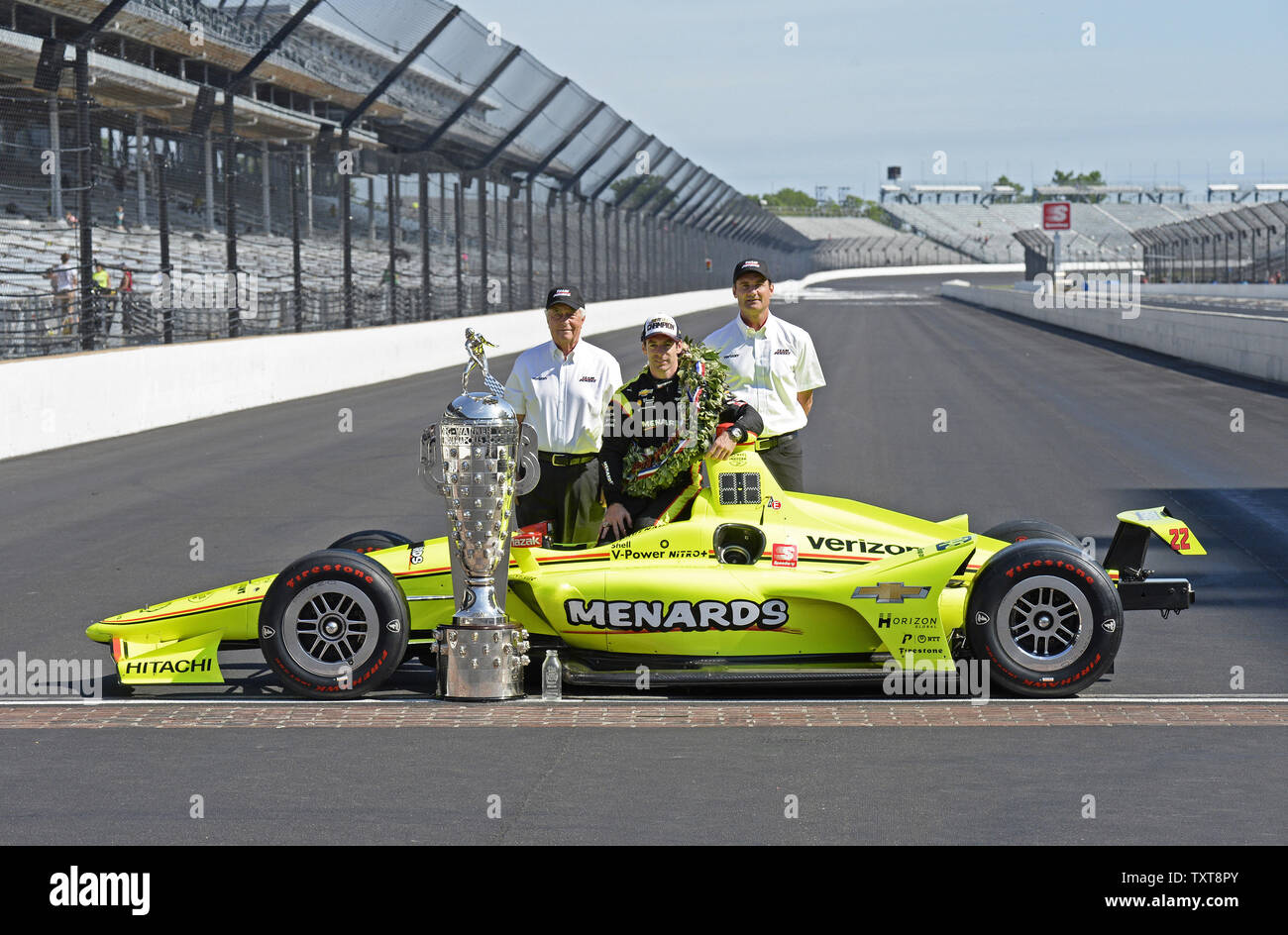 Simon Pagenaud (center) poses with Team Owner Roger Penske (L) and Team ...