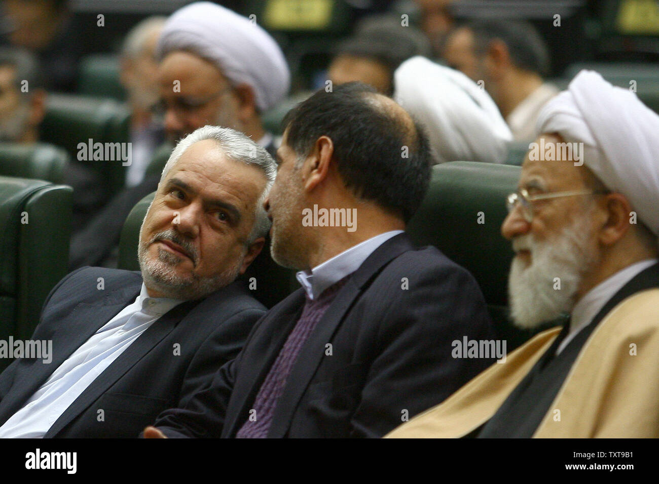 First Vice President Mohammad Reza Rahimi (L) speaks with one of the ...