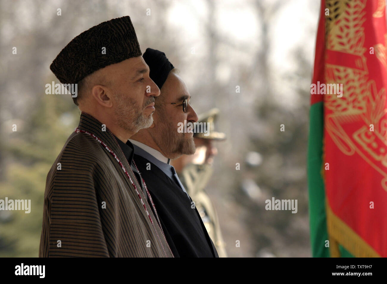 Iranian President Mohammad Khatami (R) and his Afghan counterpart Hamid ...