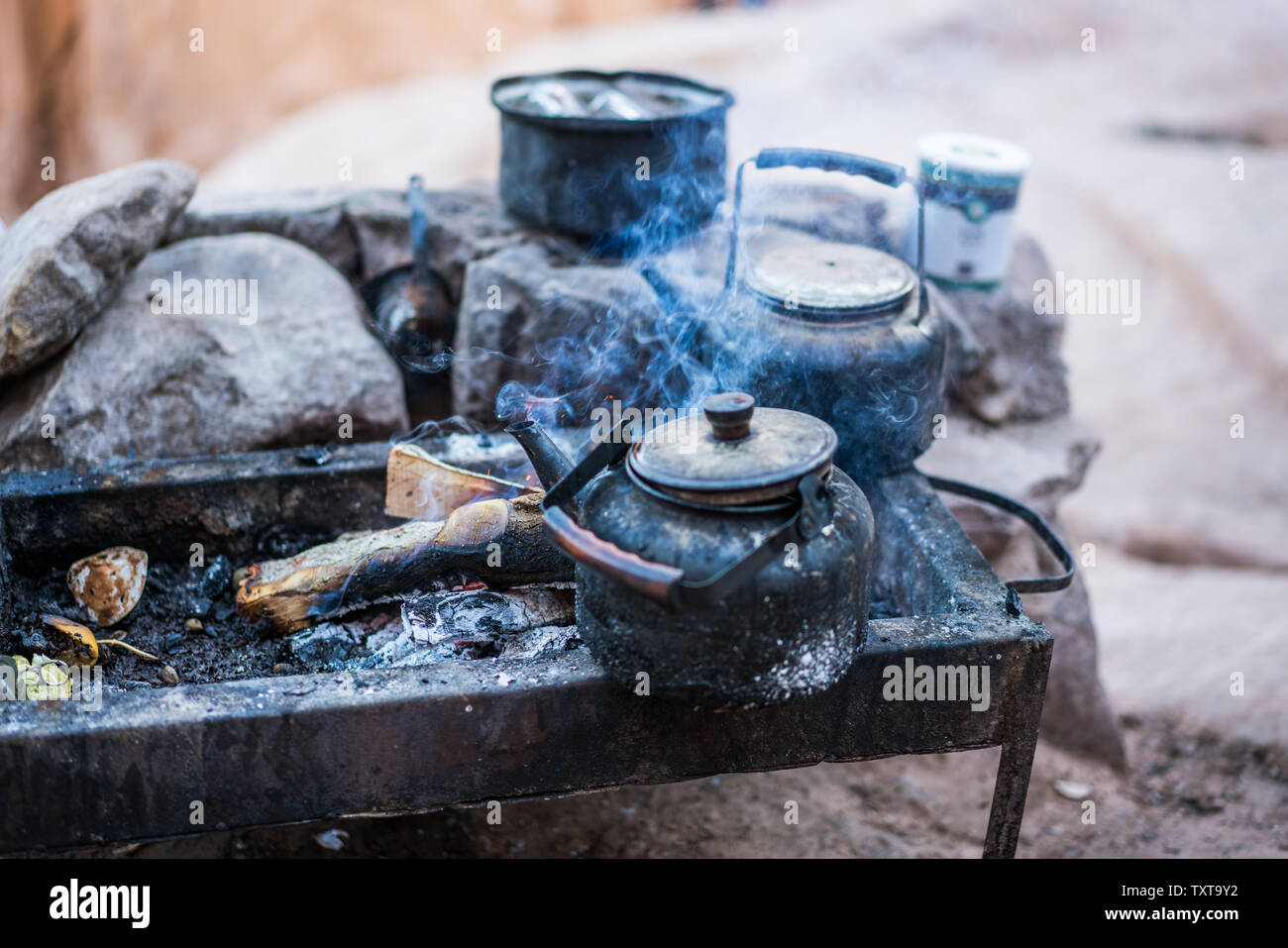 Cooking of cup of tea, Petra, Jordan Stock Photo - Alamy