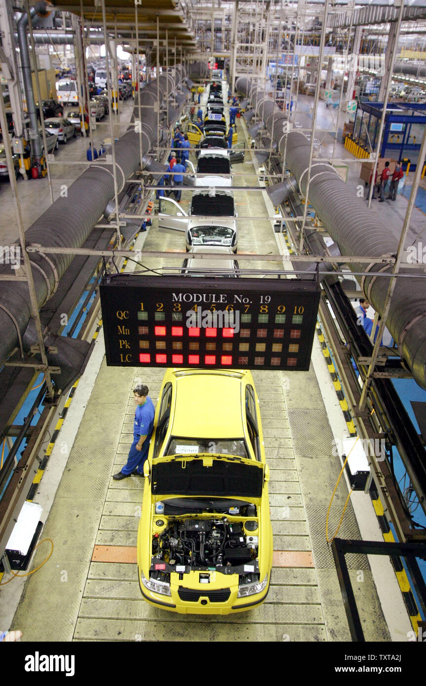 Workers of Iran Khodro work on an assembly line producing Iran's ...