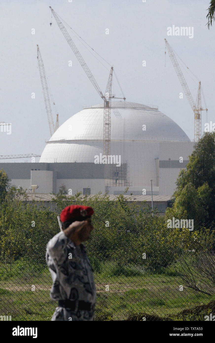 Guards keep watch at the main reactor building of Bushehr nuclear power ...