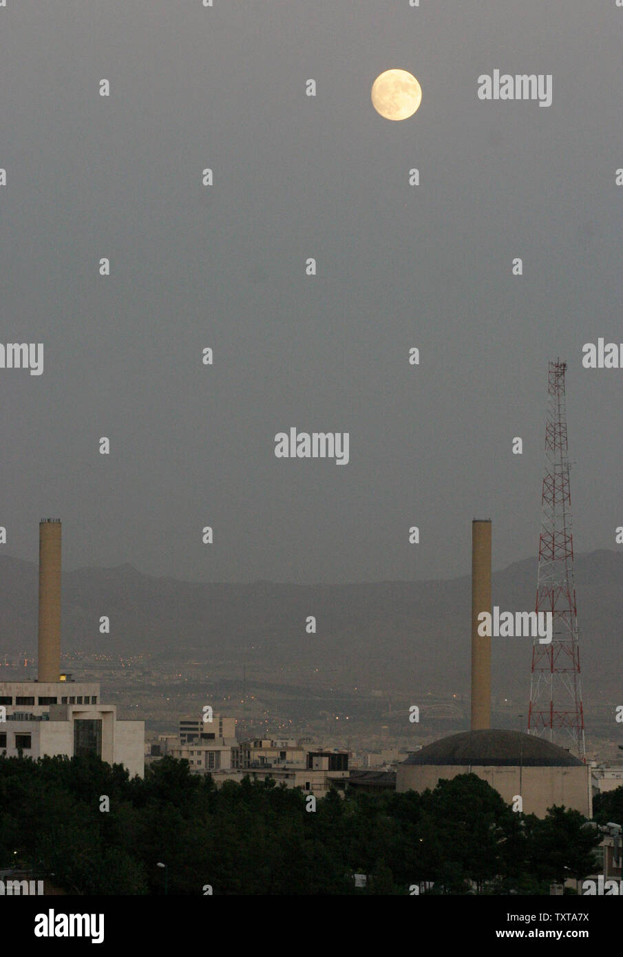 The moon rises behind the research building at Tehran Nuclear Energy in ...