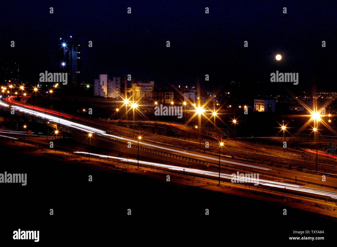 The full moon rises behind the research building at Tehran Nuclear ...